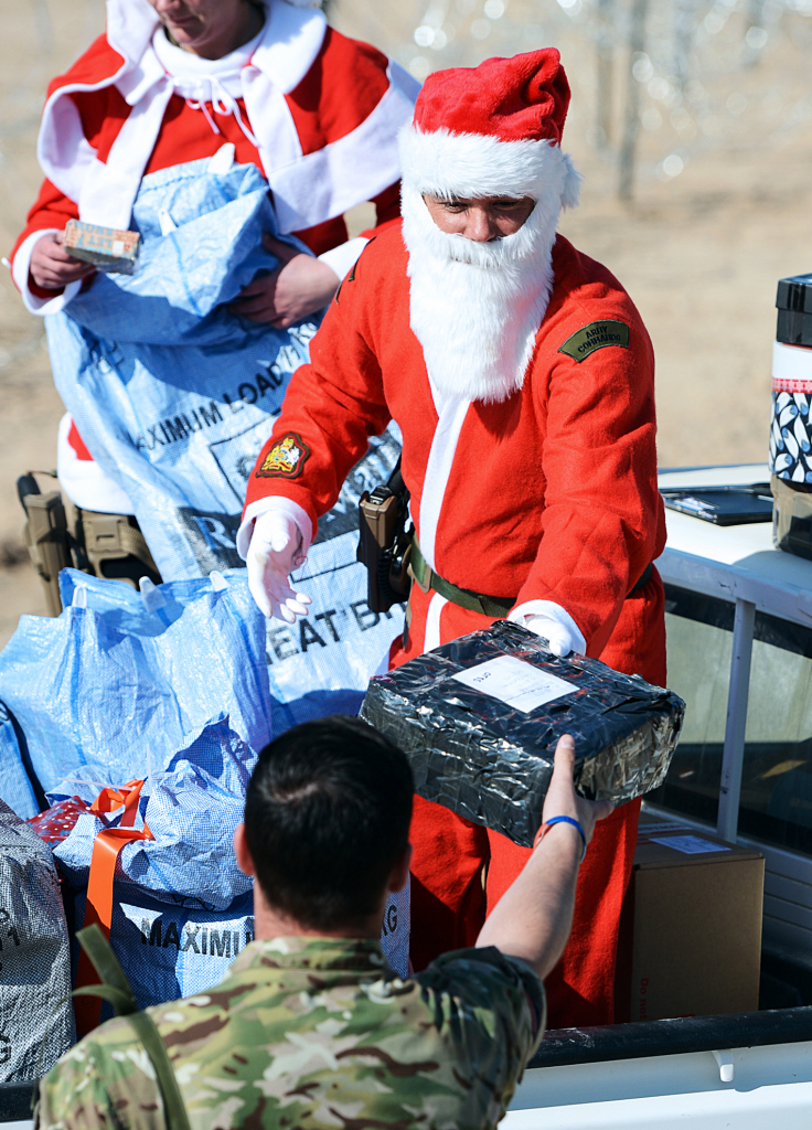 Santa Claus Delivering Christmas Parcels to Troops - Armed Forces Lawyers